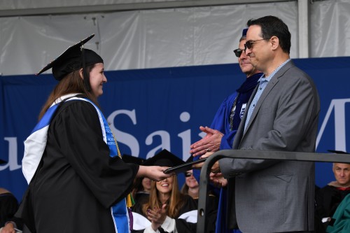 Grad and dad share milestone moment at Mount Commencement | Mount Saint ...