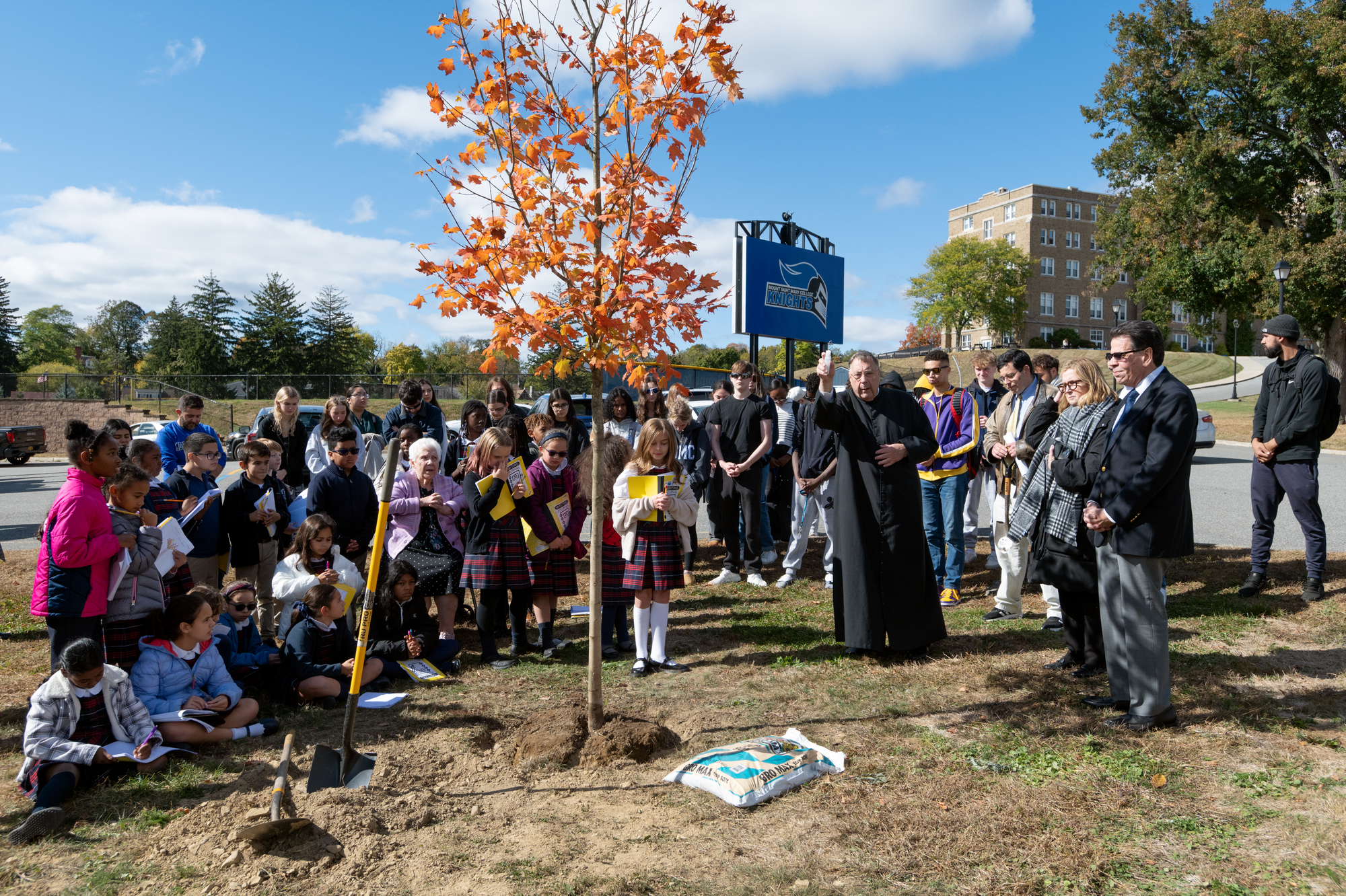 Mount freshmen, Bishop Dunn students plant pair of trees on campus ...