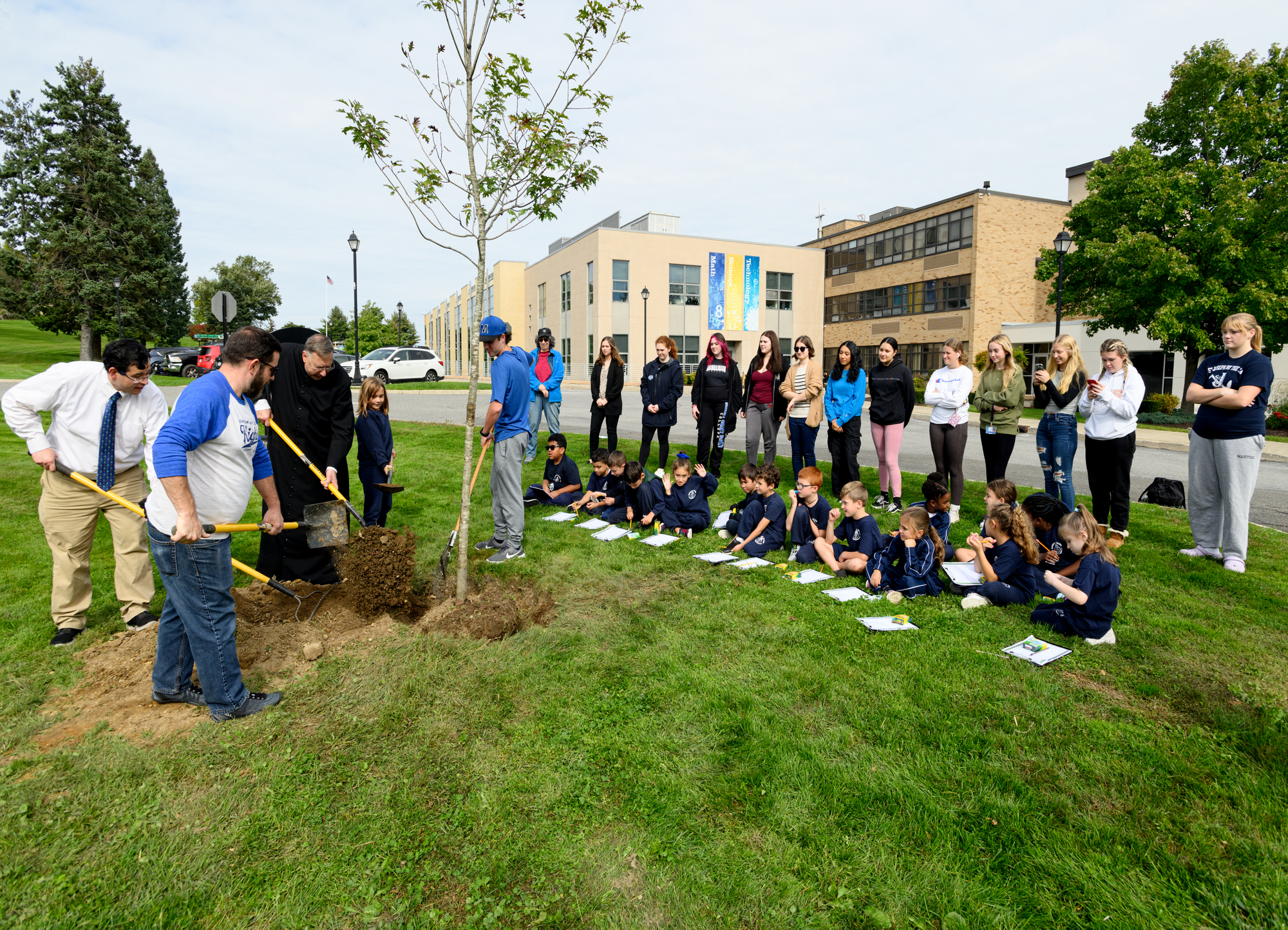 Mount freshmen, Bishop Dunn students plant tree on campus | Mount Saint ...